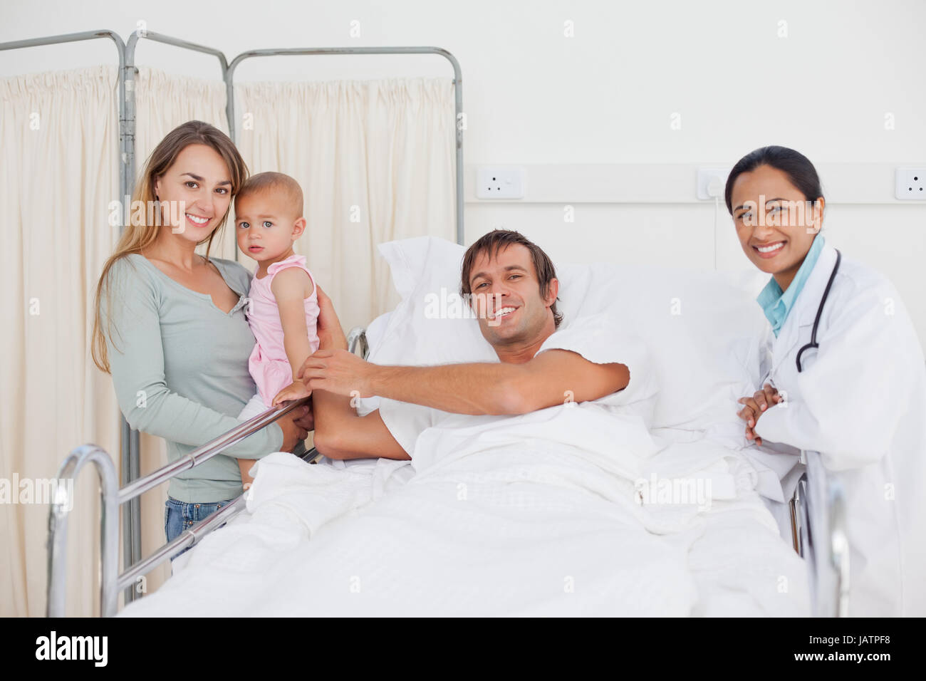 Hospital bed surrounded hi-res stock photography and images - Alamy