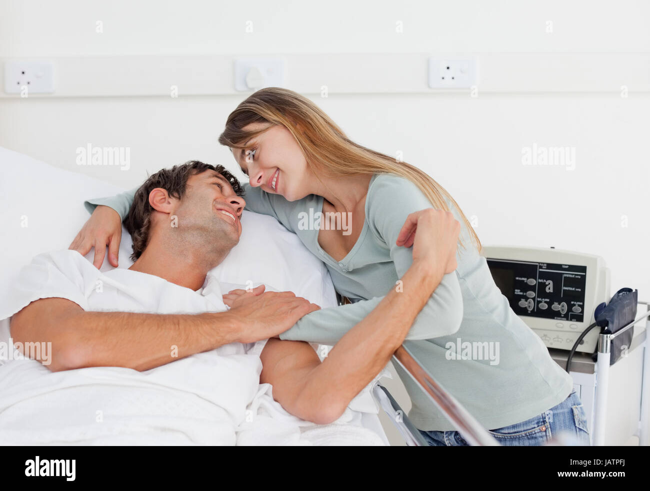 Couple hugging in hospital hi-res stock photography and images - Alamy