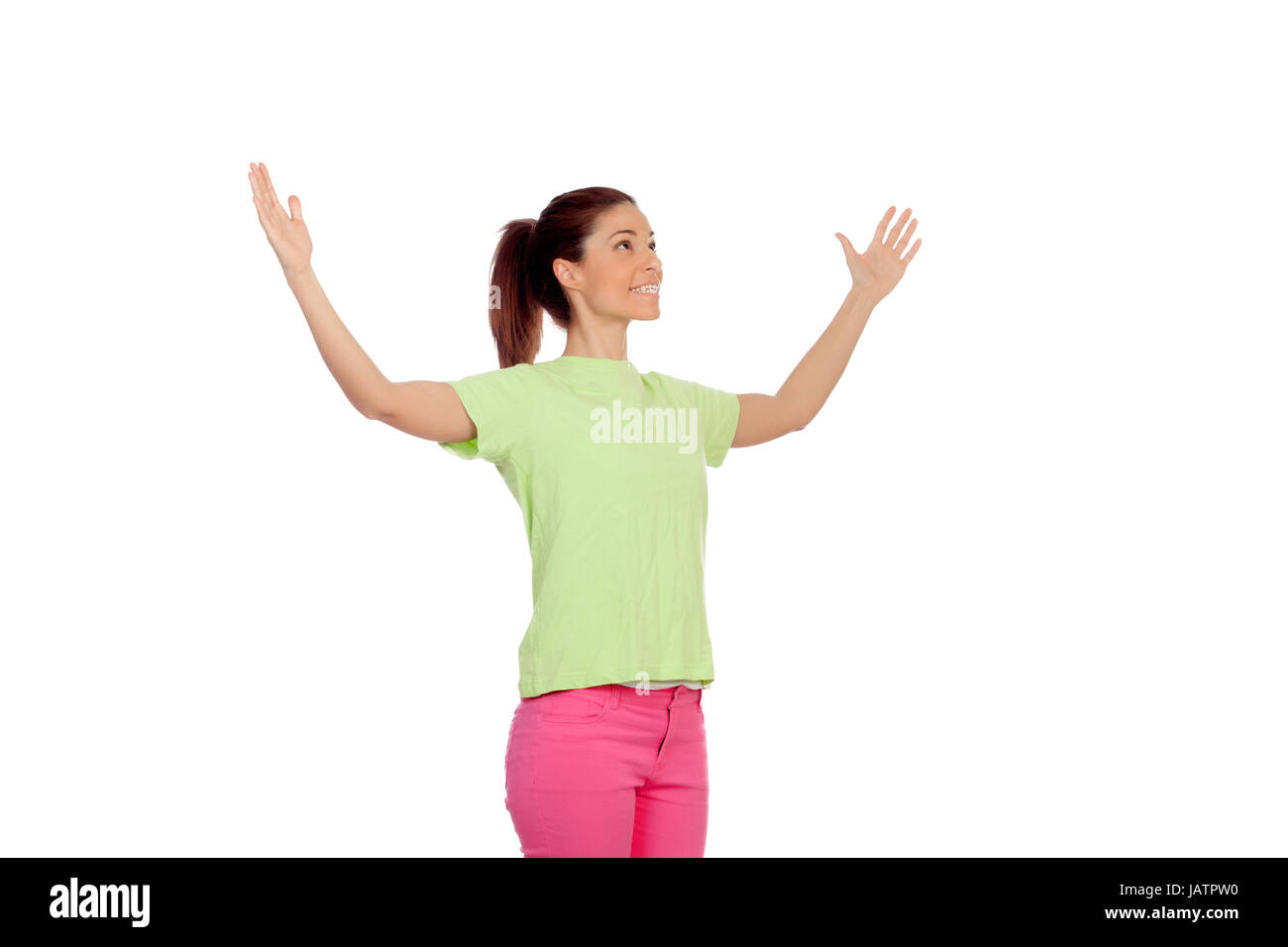 Funny young woman with raised her arms isolated on a white background ...