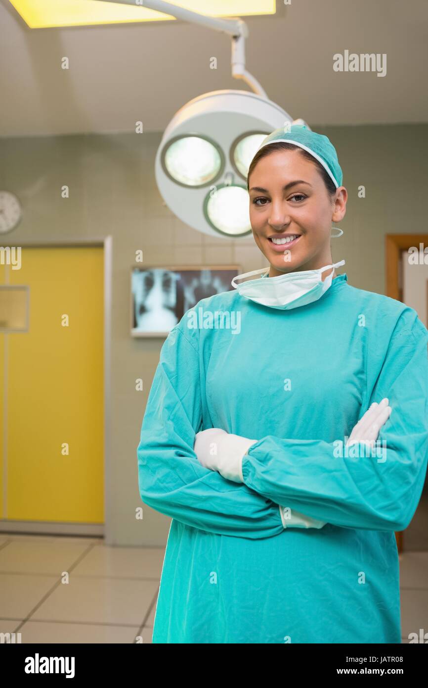 Nurse with arms crossed smiling Stock Photo - Alamy