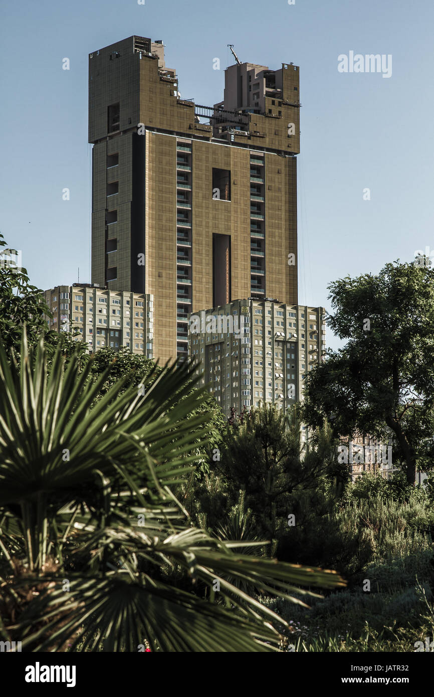 View of big city buildings from a green park field Stock Photo - Alamy