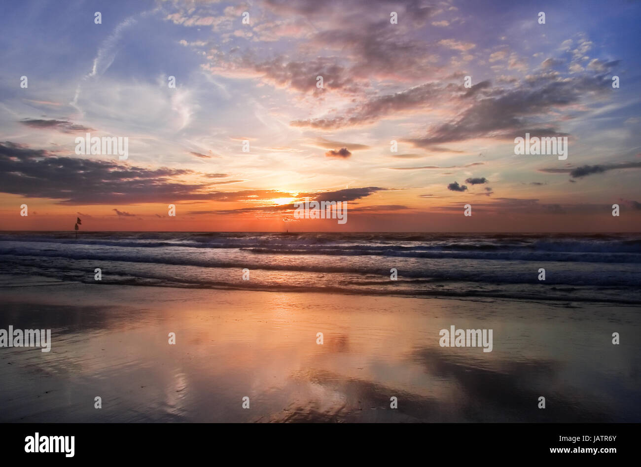 Colorful cloudy sunset at the beach with reflection - horizontal Stock ...