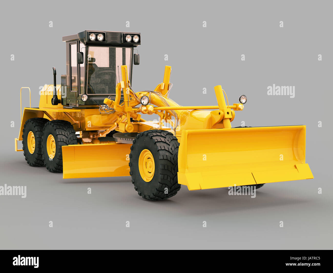 Modern three-axle road grader on a gray background Stock Photo - Alamy