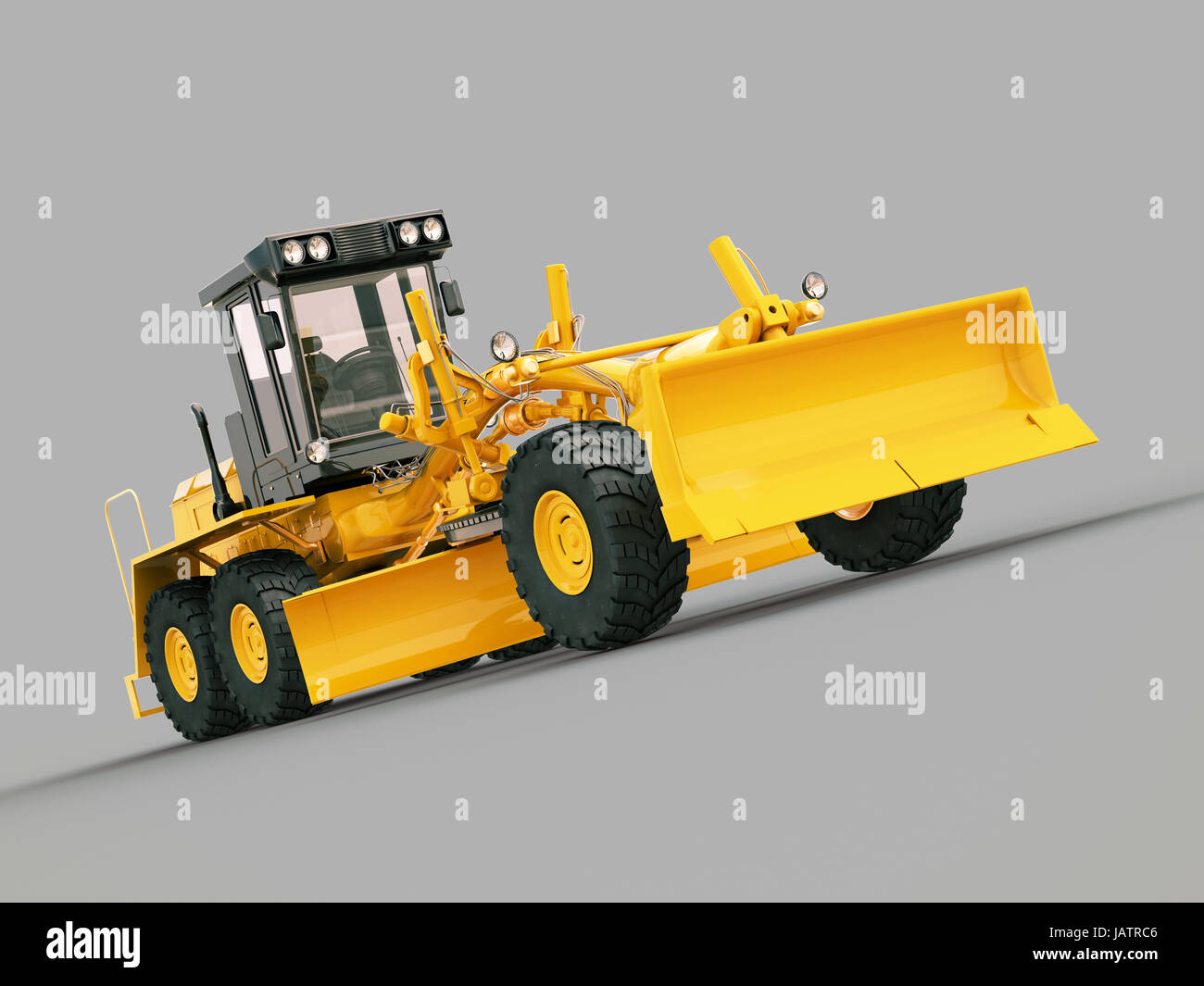 Modern three-axle road grader on a gray background Stock Photo - Alamy