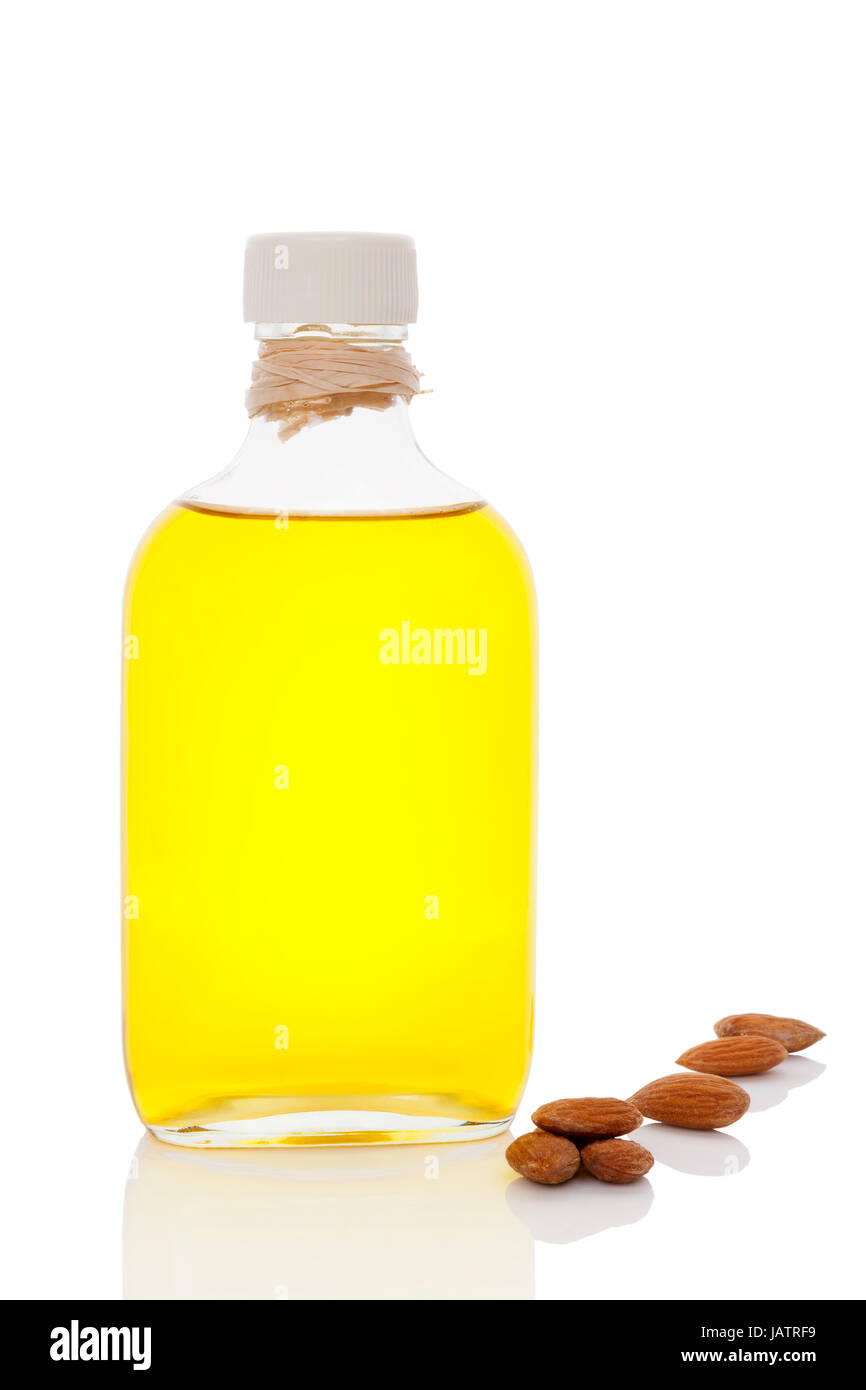 Organic almond oil in glass bottle and almonds isolated on white ...