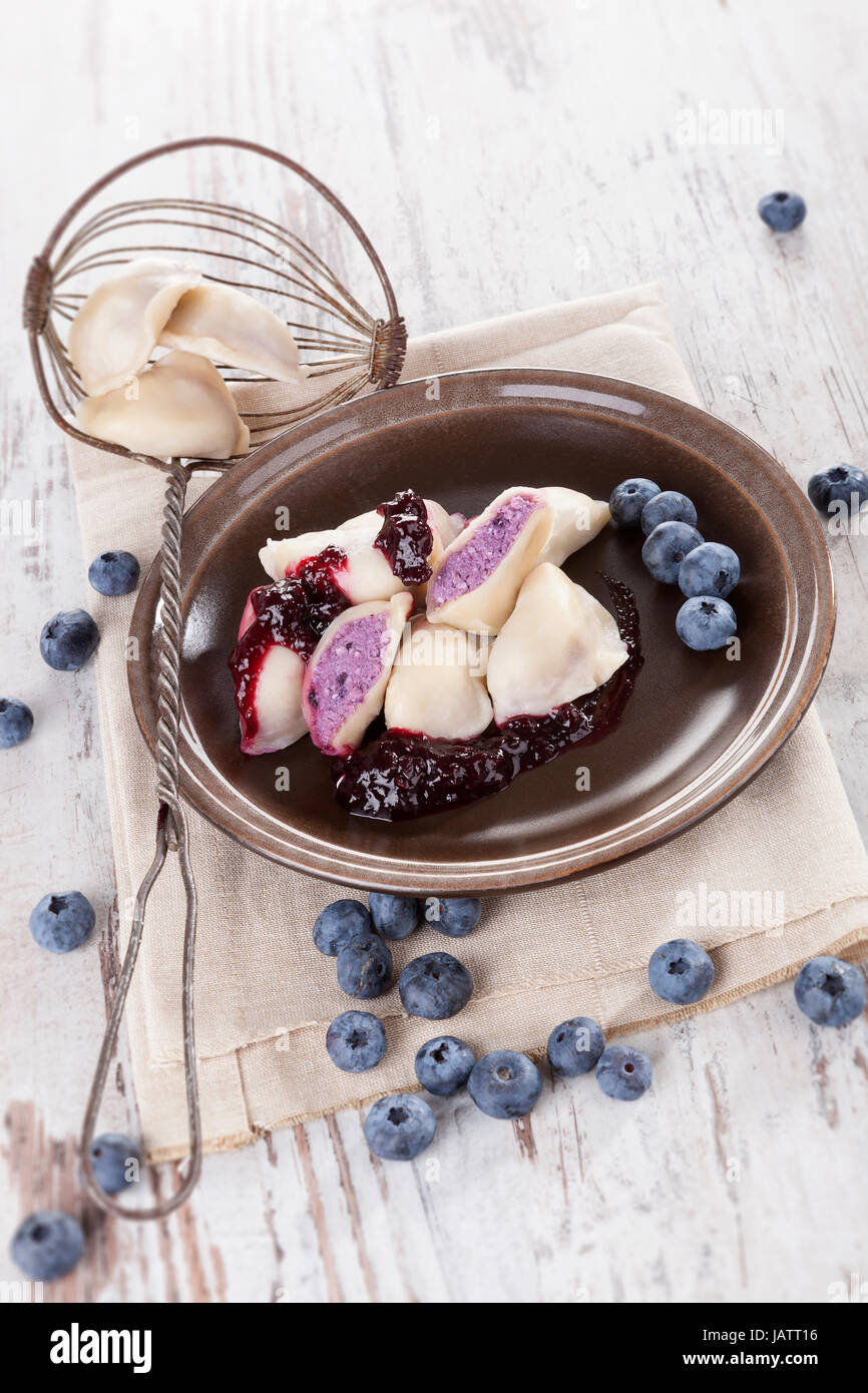 Delicious sweet dessert, rustic country style. Blueberry dumpling on ...