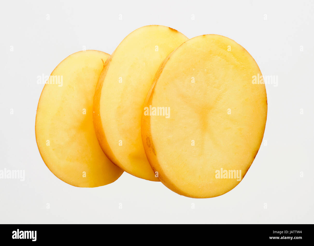 Sliced of raw potato - cross section Stock Photo - Alamy