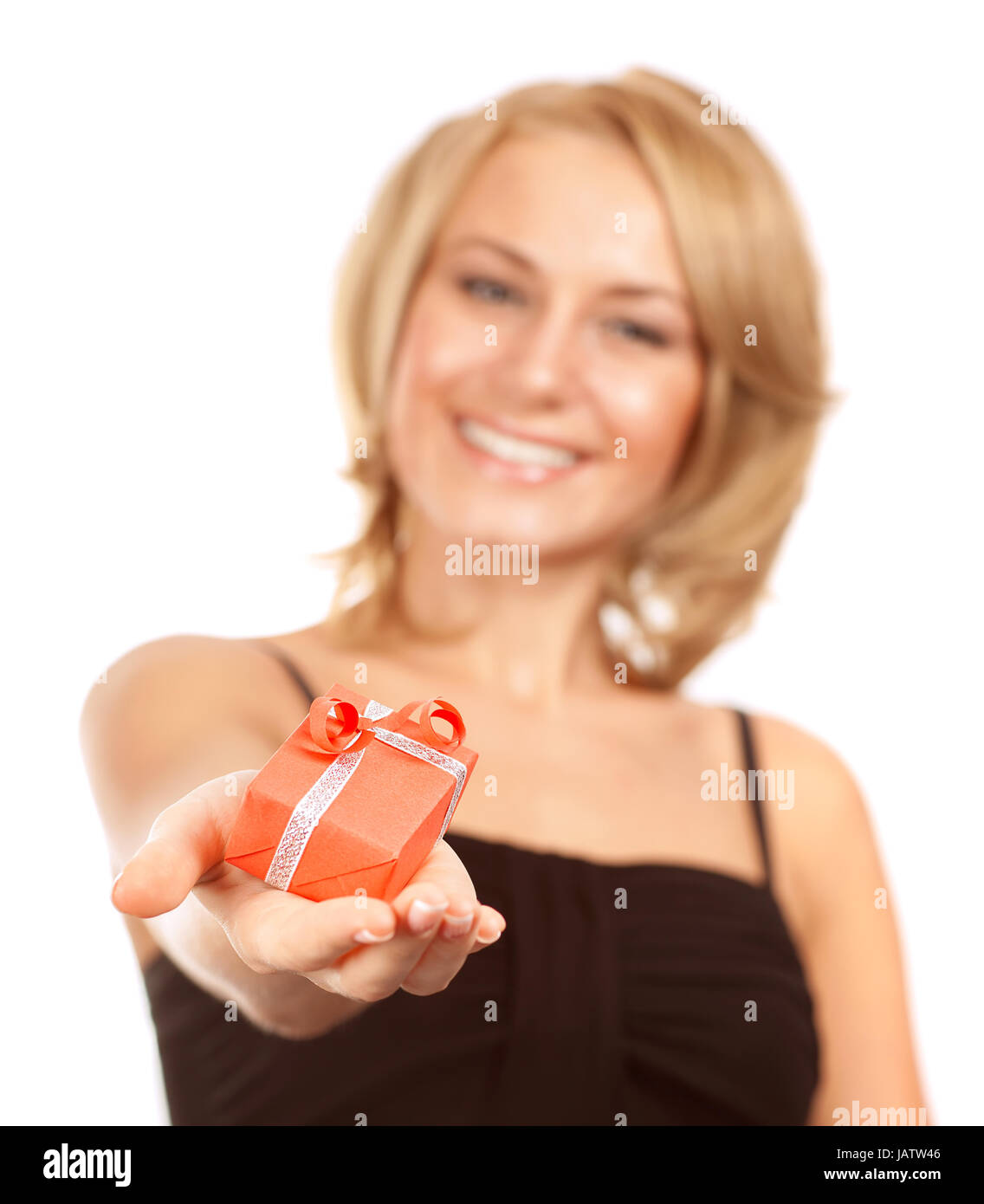 Portrait of beautiful blond woman holding in hand little present box ...