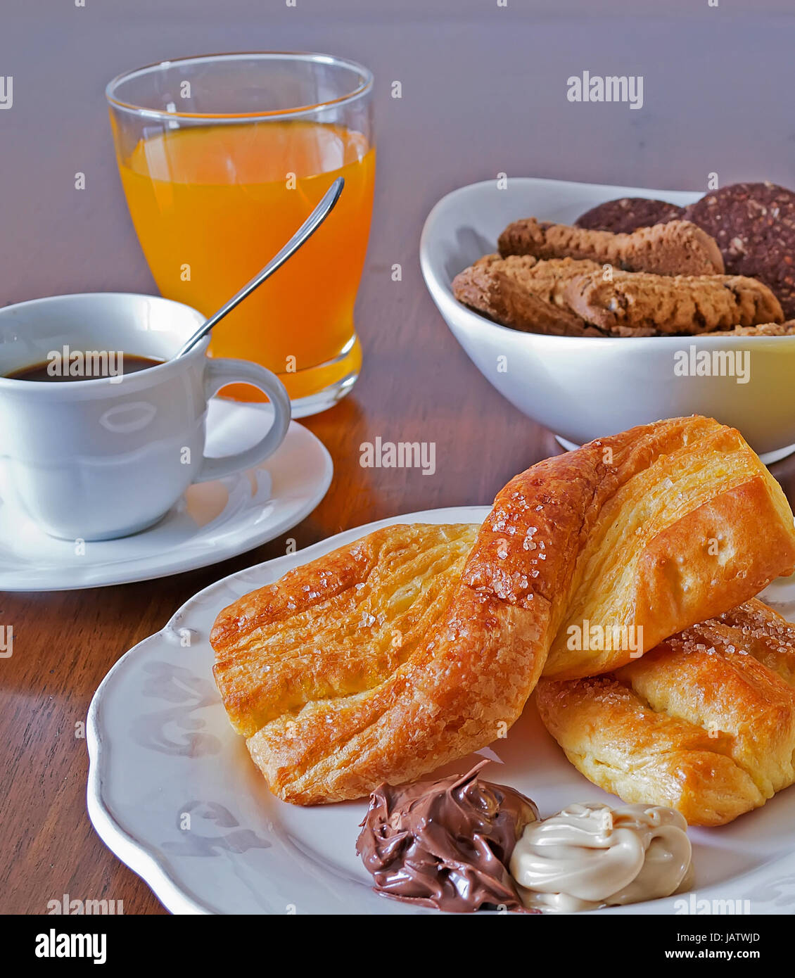 breakfast set with snack, fruit juice, cookies, coffee and tea Stock ...