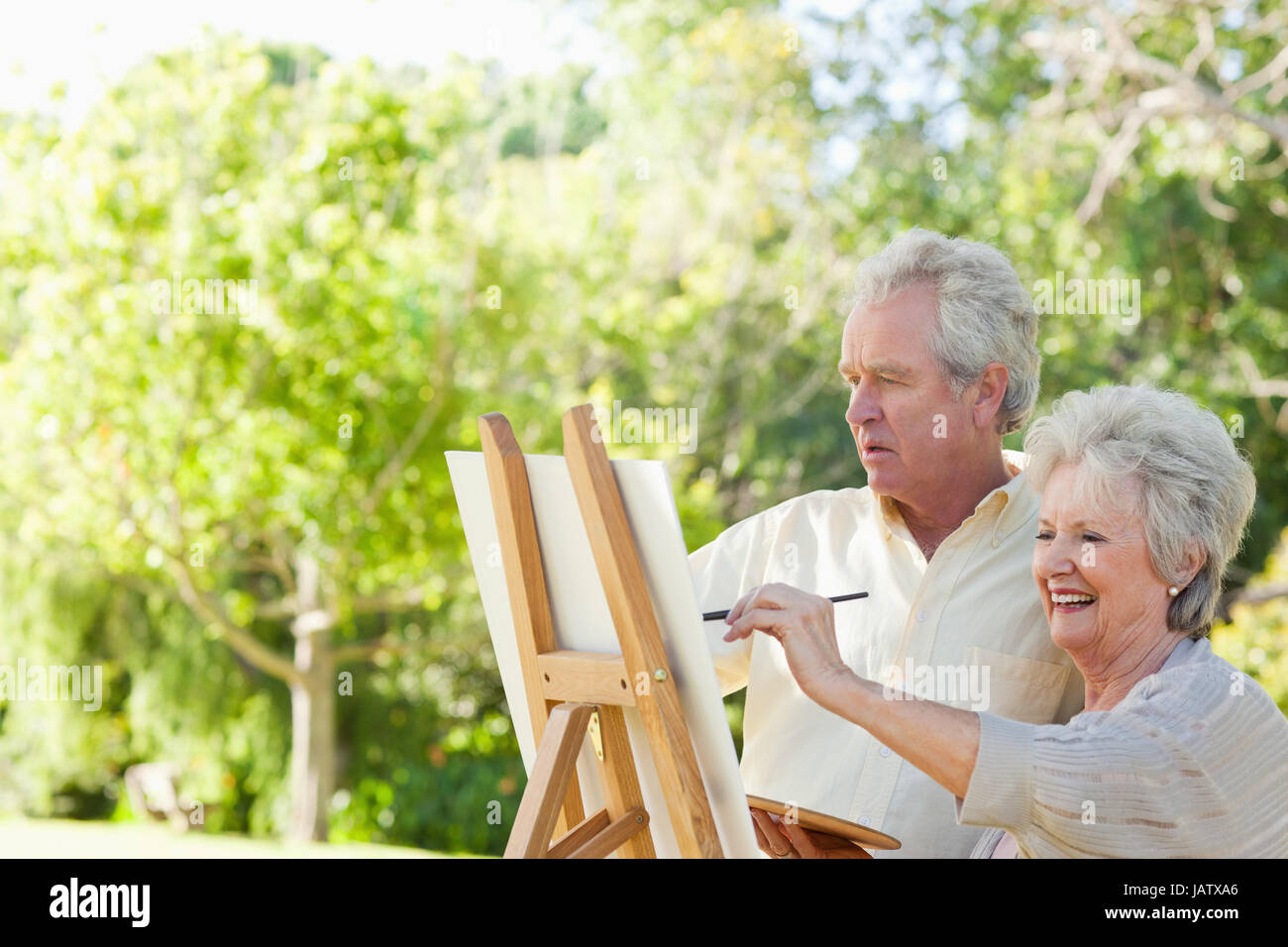 Two friends painting a picture Stock Photo - Alamy