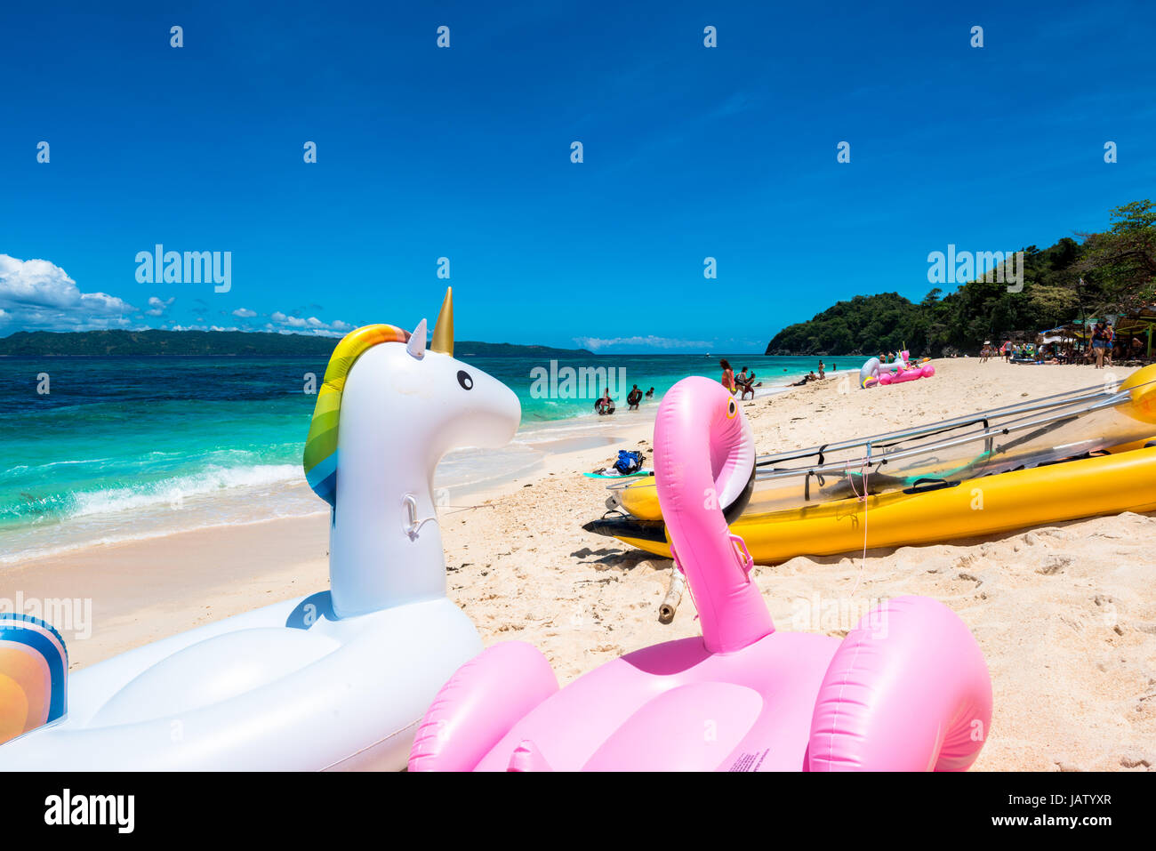 swimming floats of unicorn and flamingo, kayak and swimming at the Puka ...