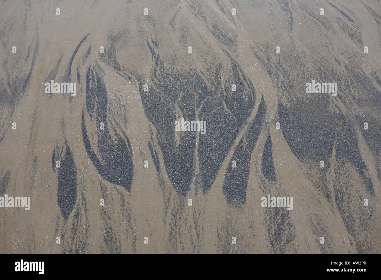 patterns in sand on beach Stock Photo - Alamy