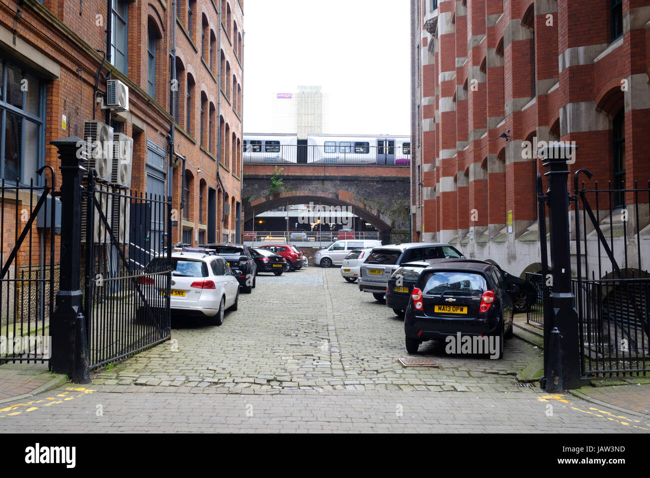Train passing over rail bridge close to Manchester Piccadilly station ...