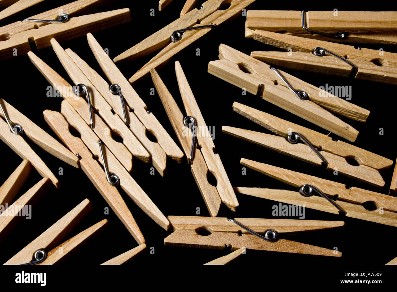 Collection of Wooden Clothes pegs on Black Background Stock Photo - Alamy