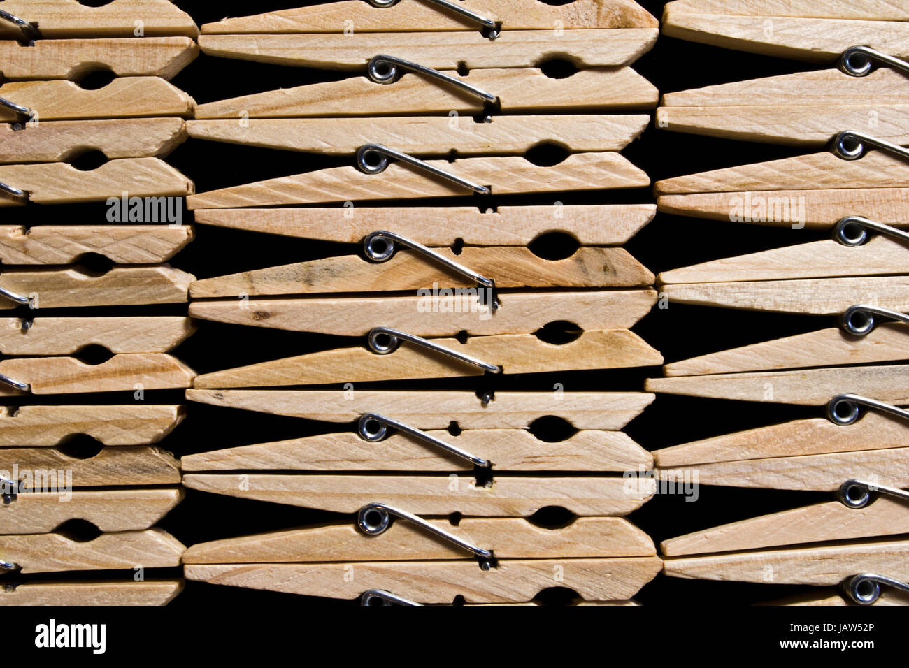 Collection of Wooden Clothes pegs on Black Background Stock Photo - Alamy