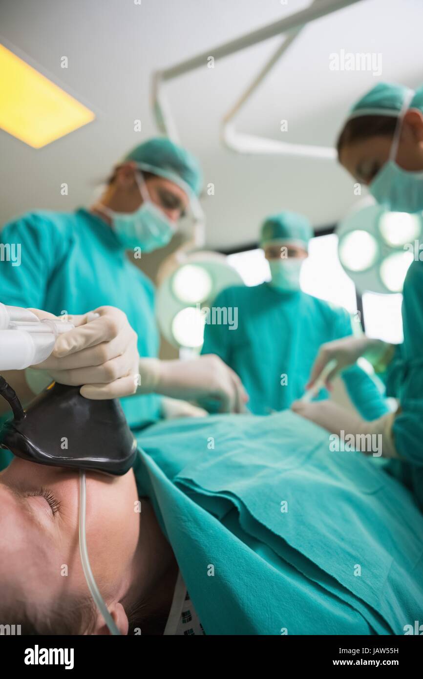 Patient lying on an operation table hi-res stock photography and images ...