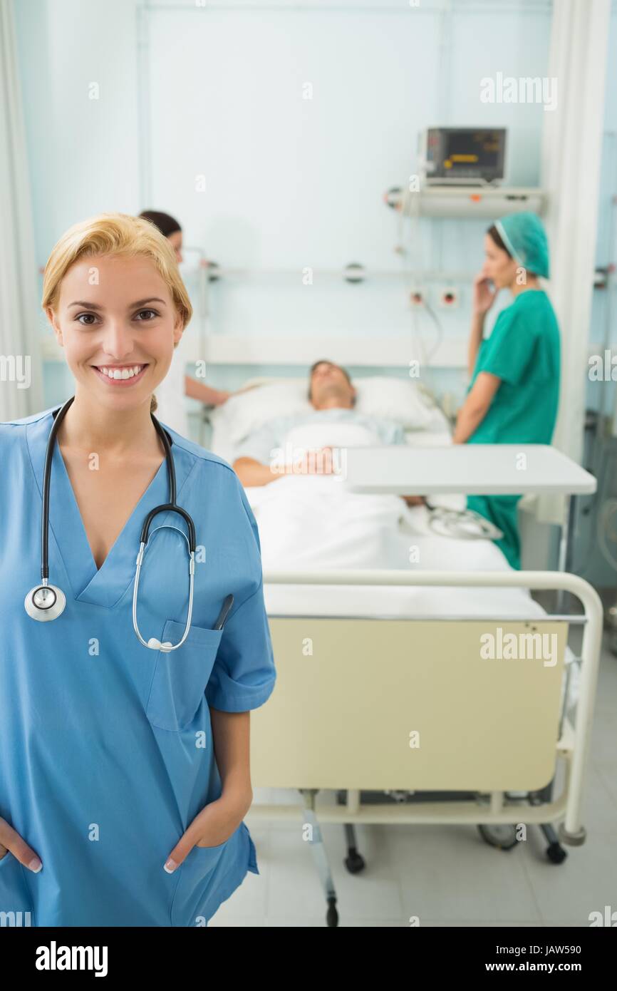 Blonde nurse smiling standing up hi-res stock photography and images ...