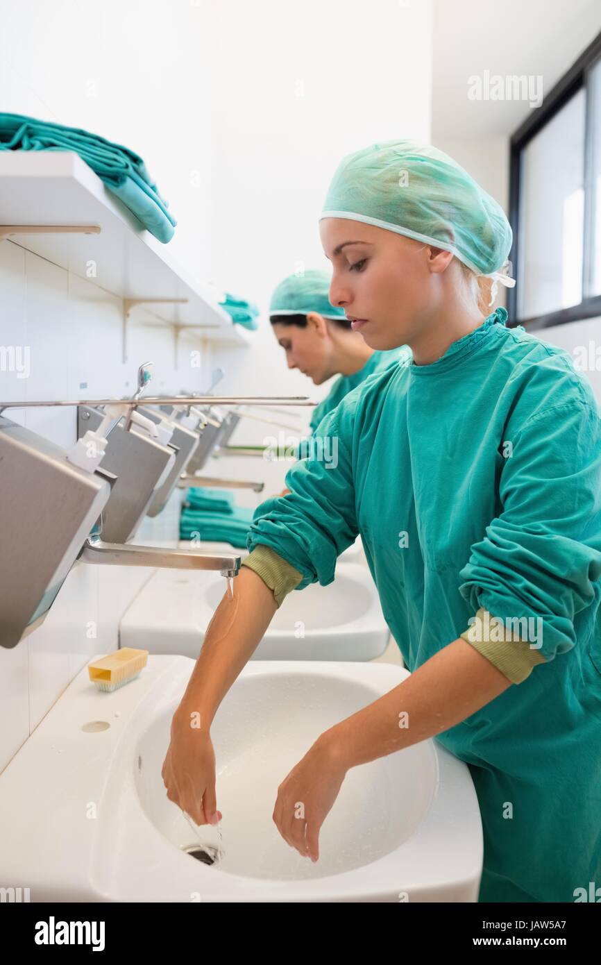 Caucasian woman washing hands under hi-res stock photography and images ...