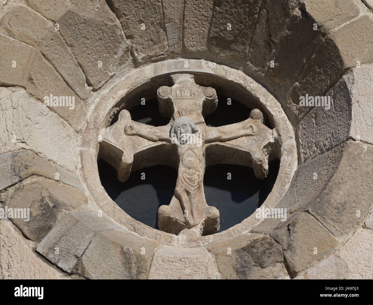 romanesque stone crucifix at the cathedral of venzone / friuli / italy ...