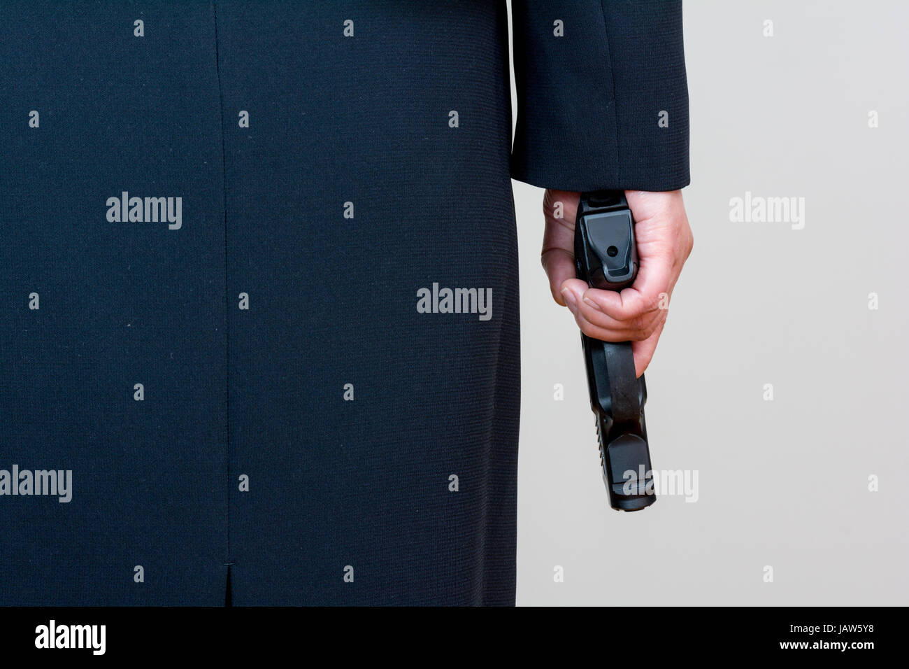 Woman in business suit holding gun hi-res stock photography and images ...