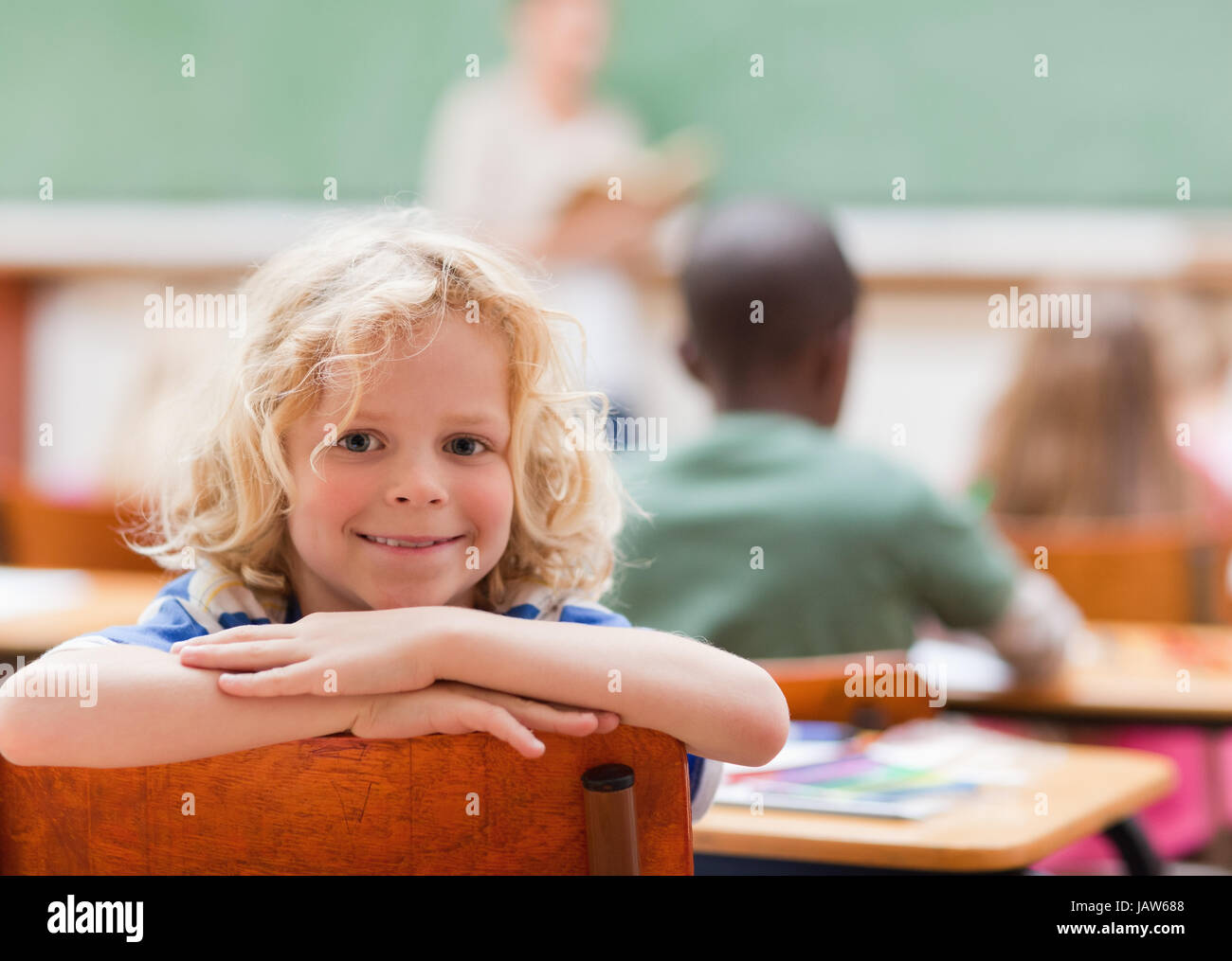 Little boy daydreaming during lesson Stock Photo - Alamy