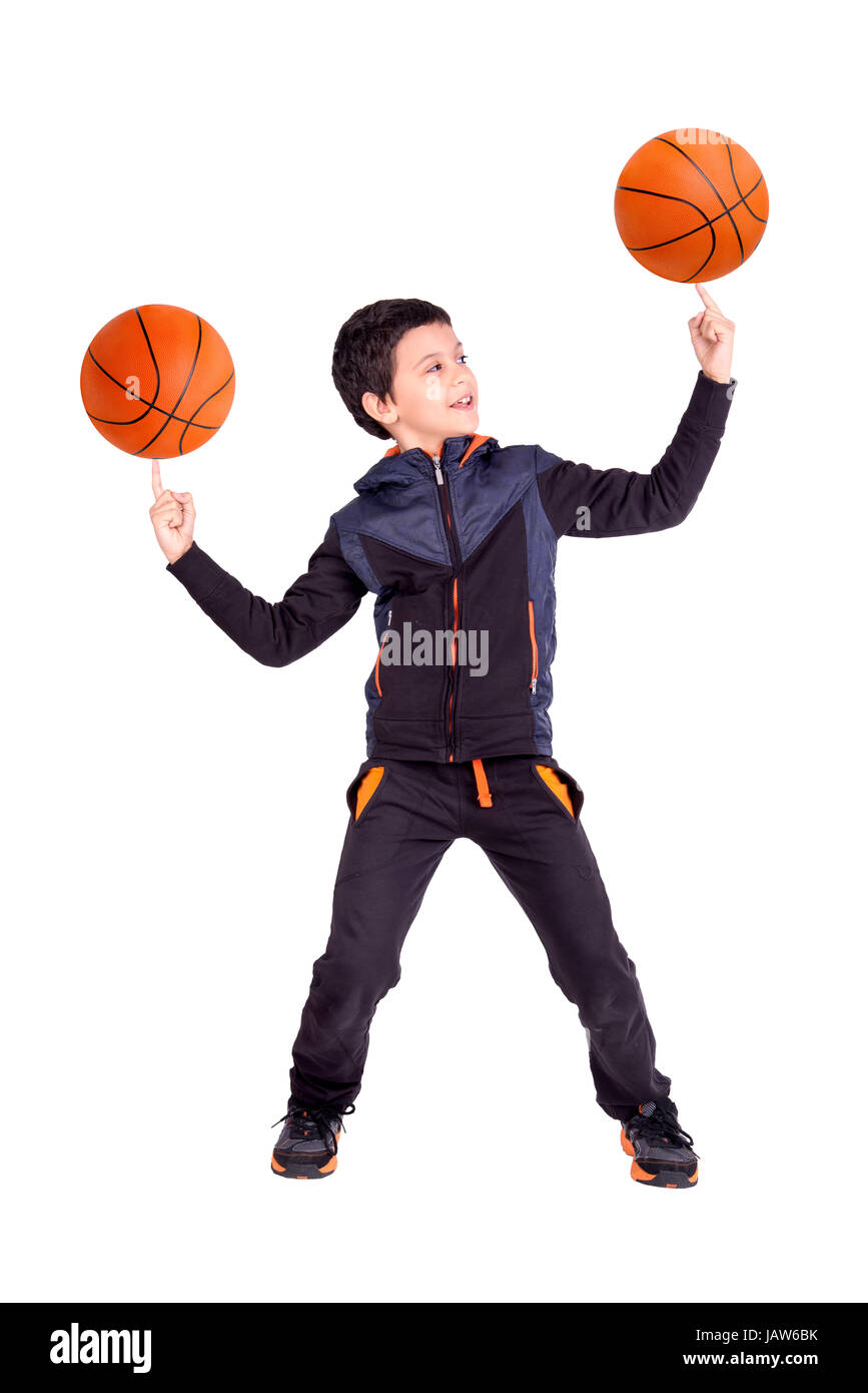 Young boy posing with a basketball ball isolated in white Stock Photo ...
