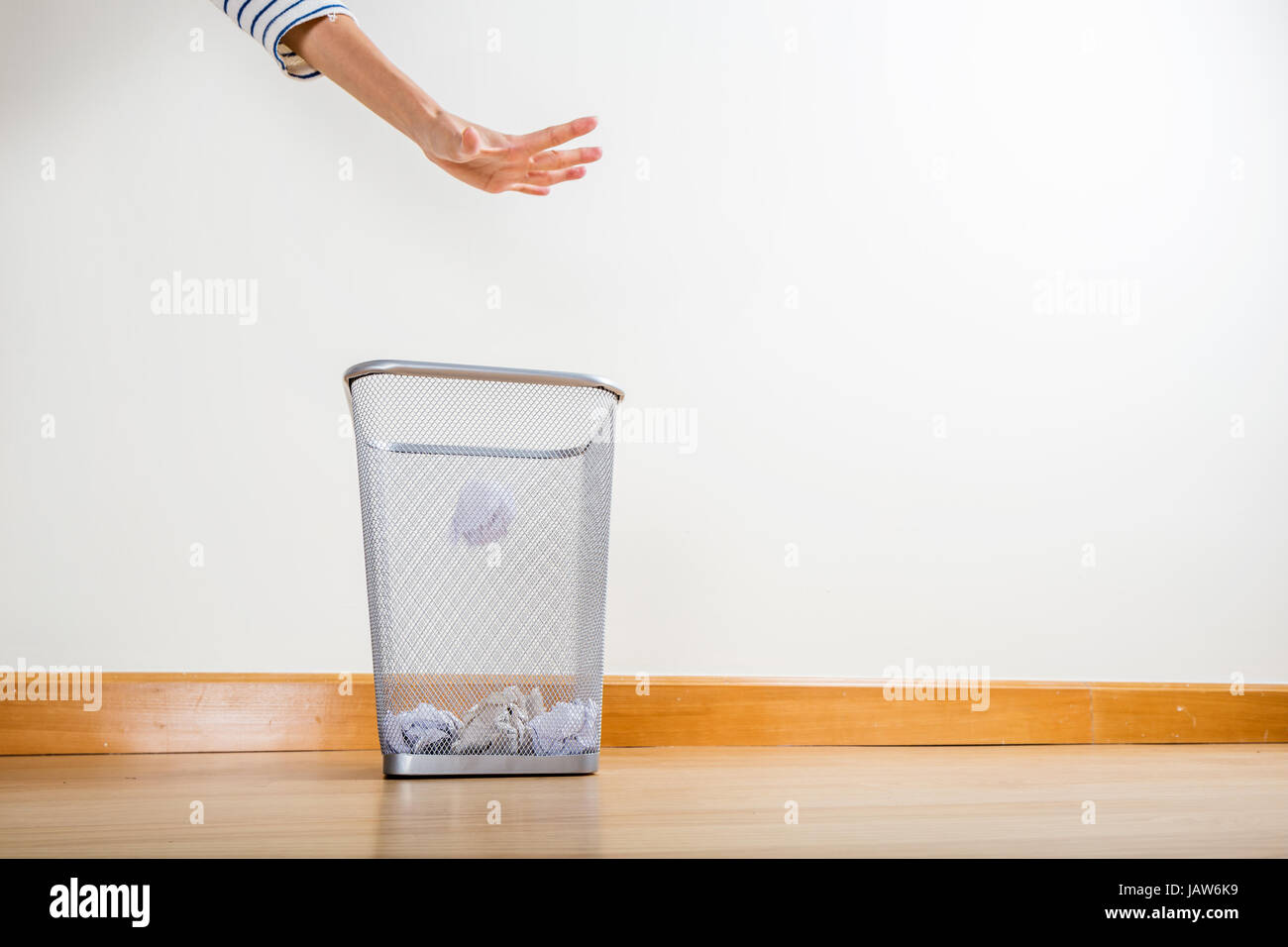 Throwing of paper ball by hand Stock Photo - Alamy