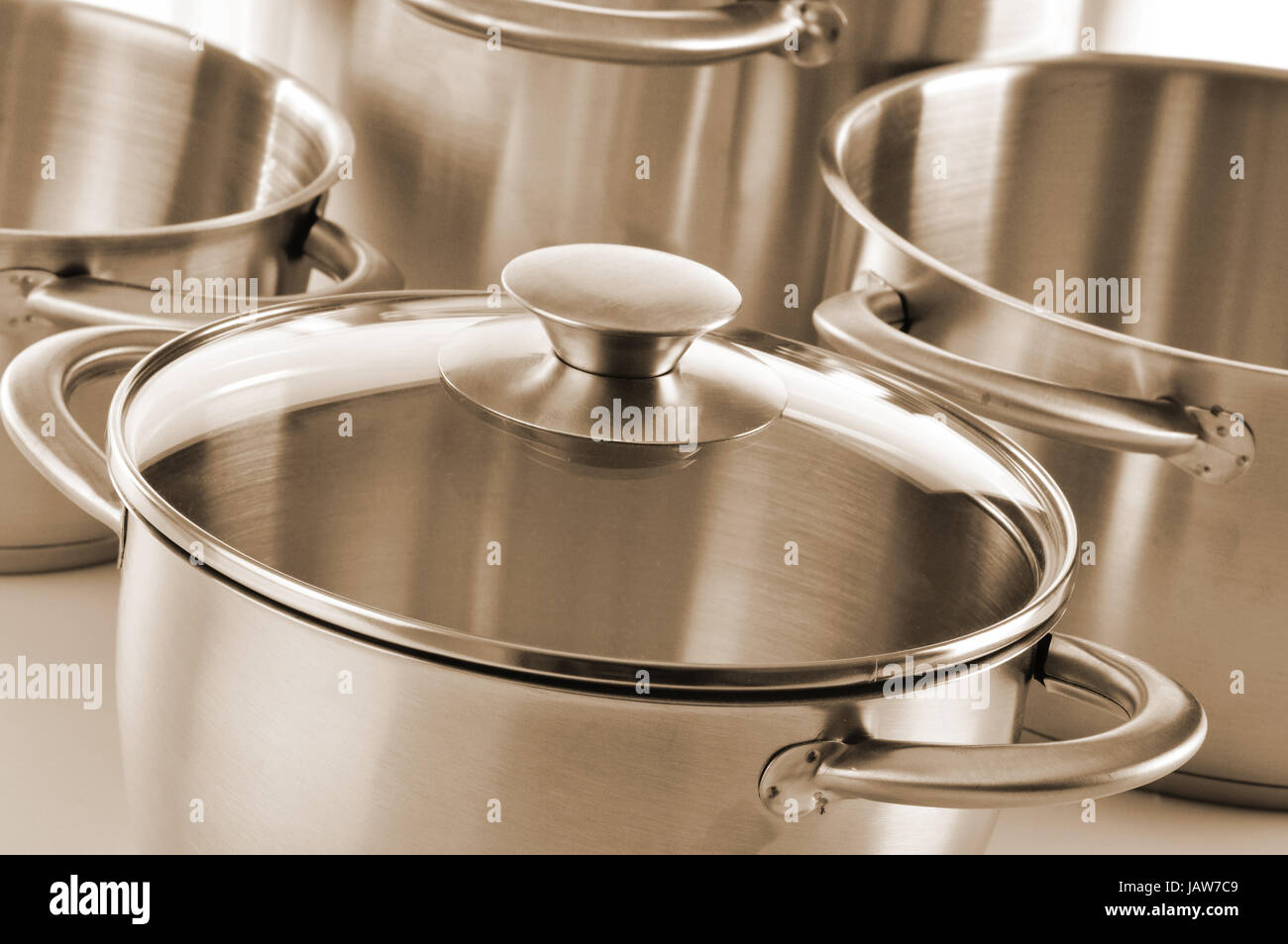 Composition with stainless pots Stock Photo - Alamy