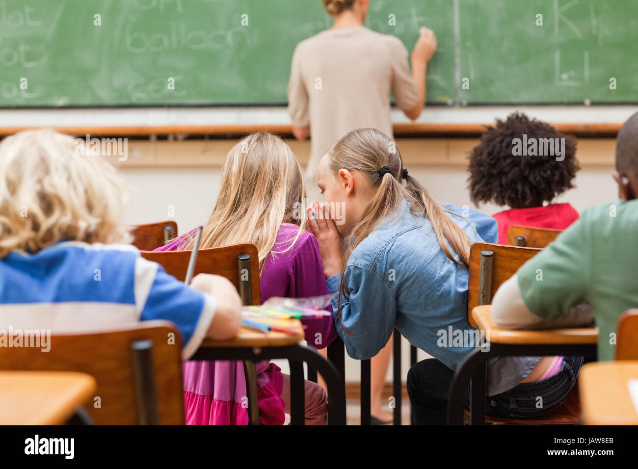 Students Whispering In Class