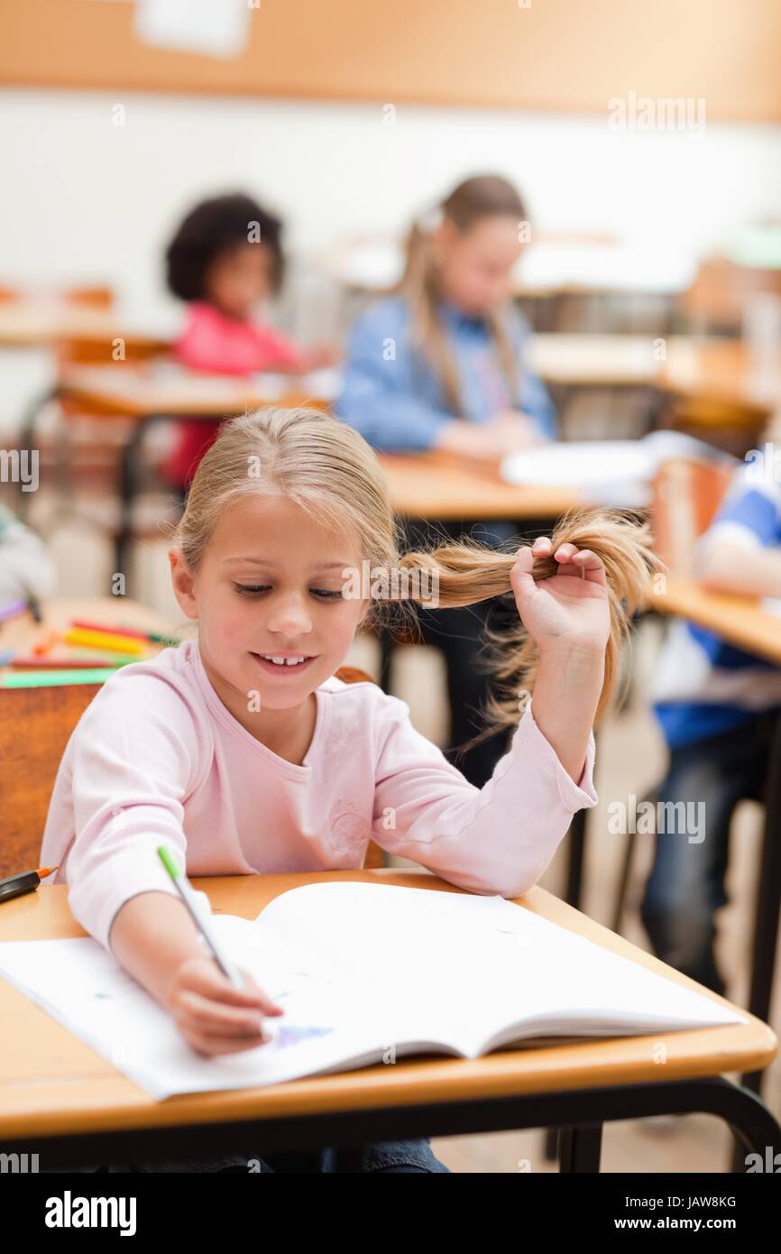 Focused student girl writing hi-res stock photography and images - Alamy