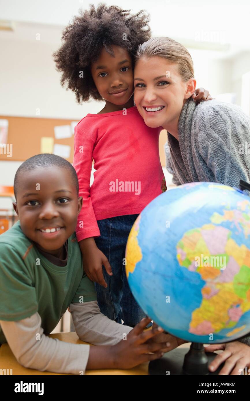 Students And Teacher With Globe High Resolution Stock Photography and ...