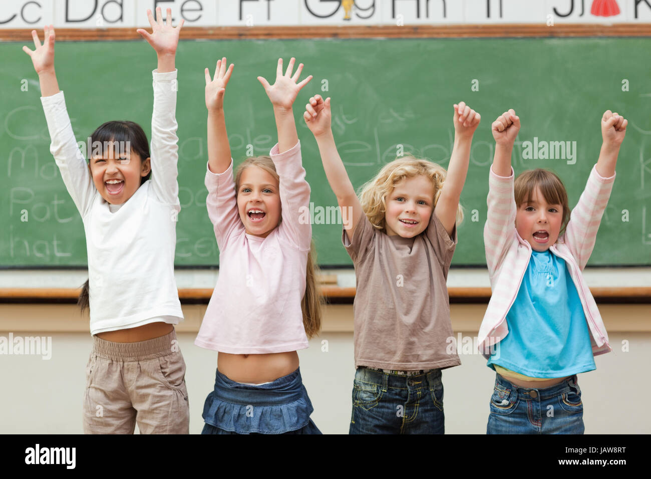 Celebrating elementary students standing hi-res stock photography and ...