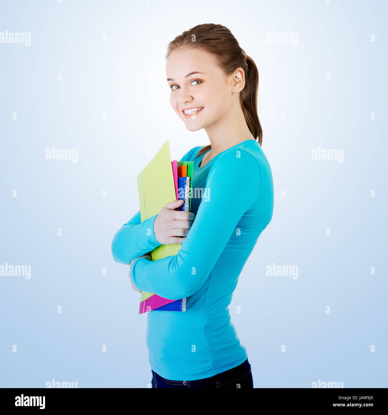 Happy student girl with notebooks Stock Photo - Alamy