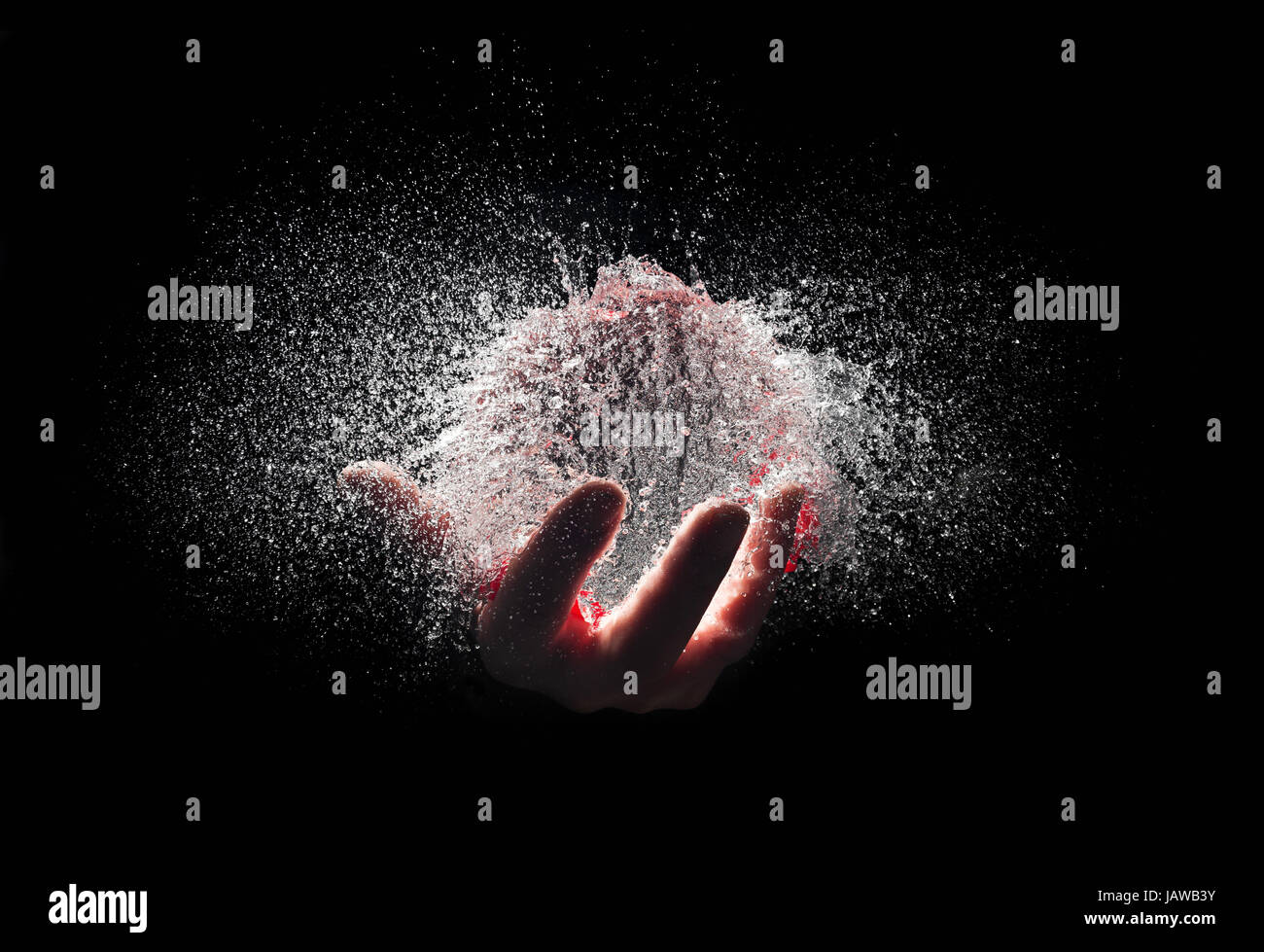 water explosion in human hand Stock Photo - Alamy