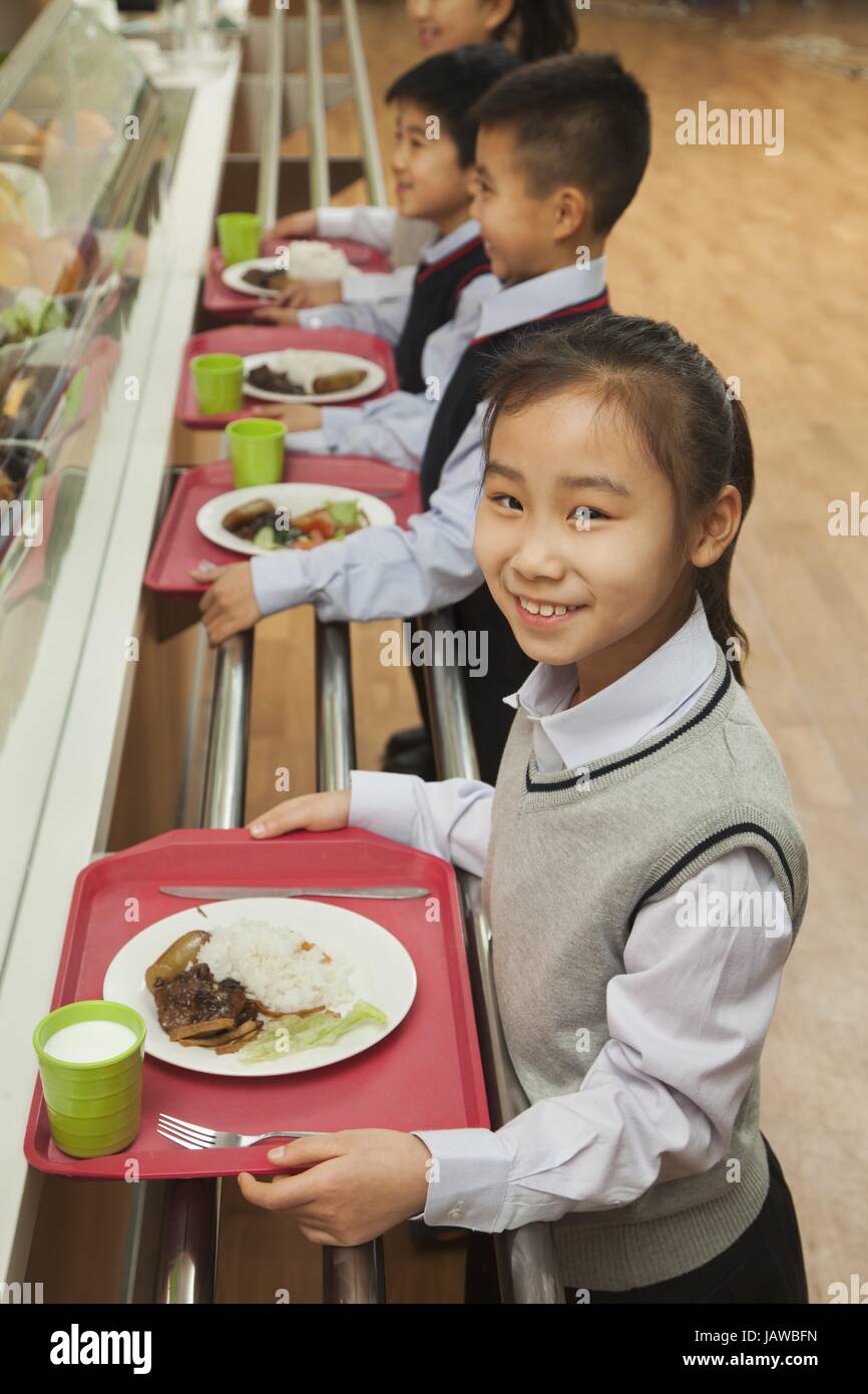 Boys eating lunch in cafeteria hi-res stock photography and images - Alamy