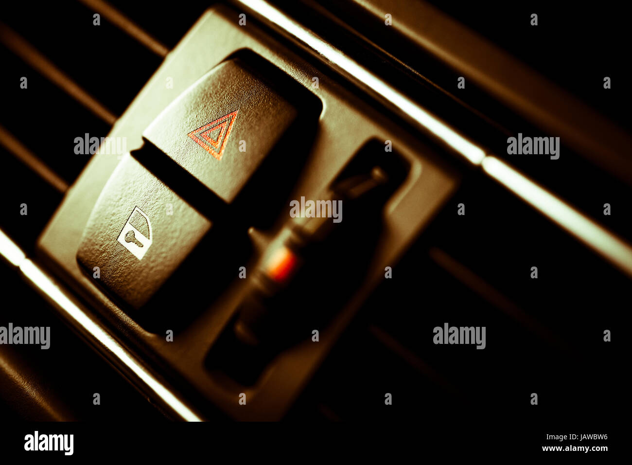 Detail of a warning button in a car Stock Photo - Alamy