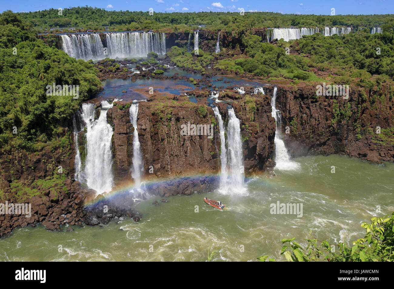 Several waterfalls on all sides falling on a river Stock Photo - Alamy