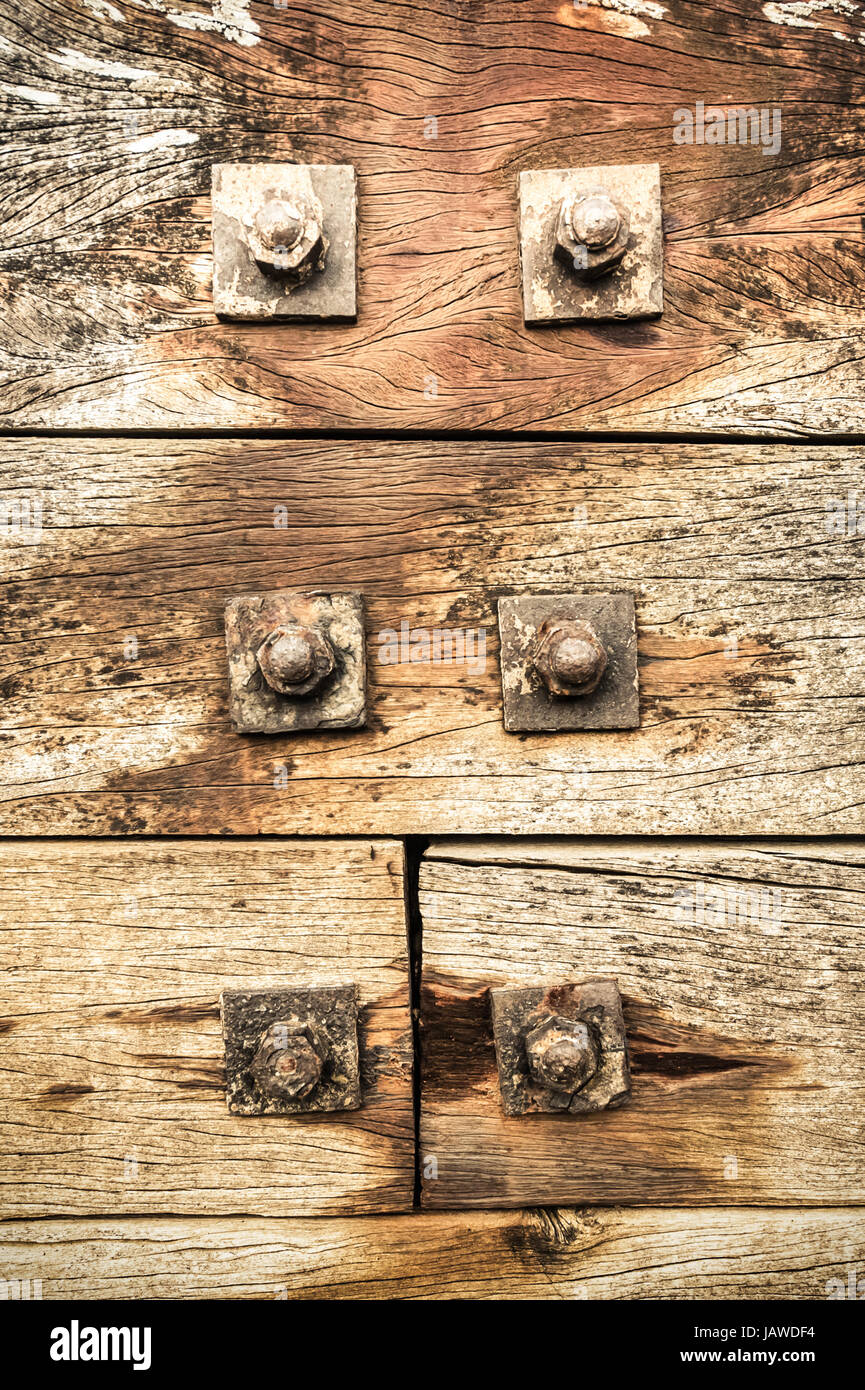 nuts and bolts fixed to grunged wood Stock Photo - Alamy