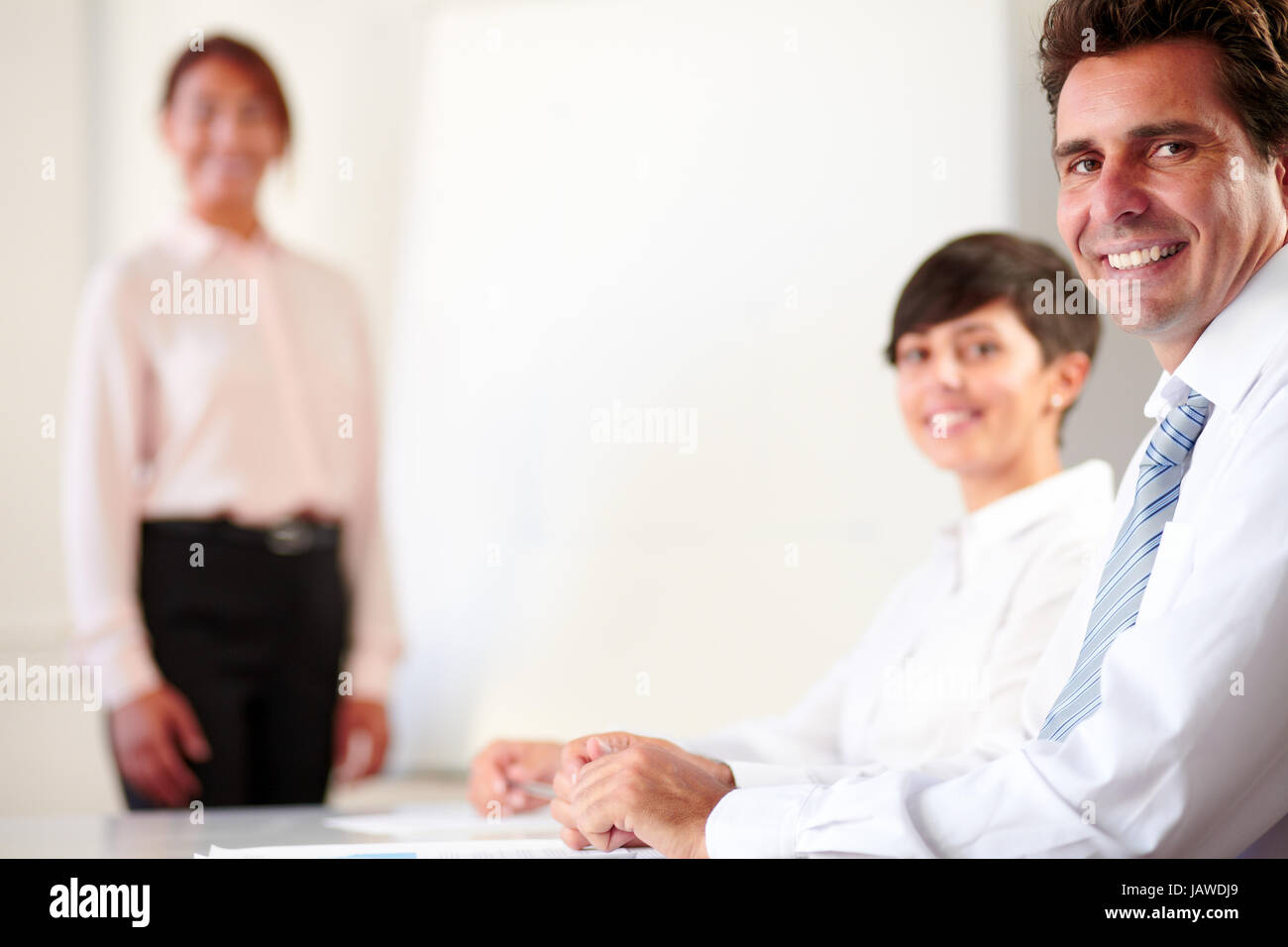 Portrait of a professional executive group smiling and looking at you ...