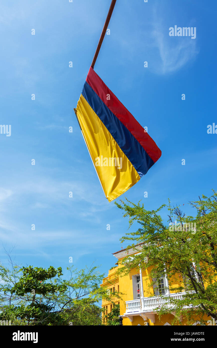 Colombian flag in the old town of Cartagena, Colombia with blue sky and ...