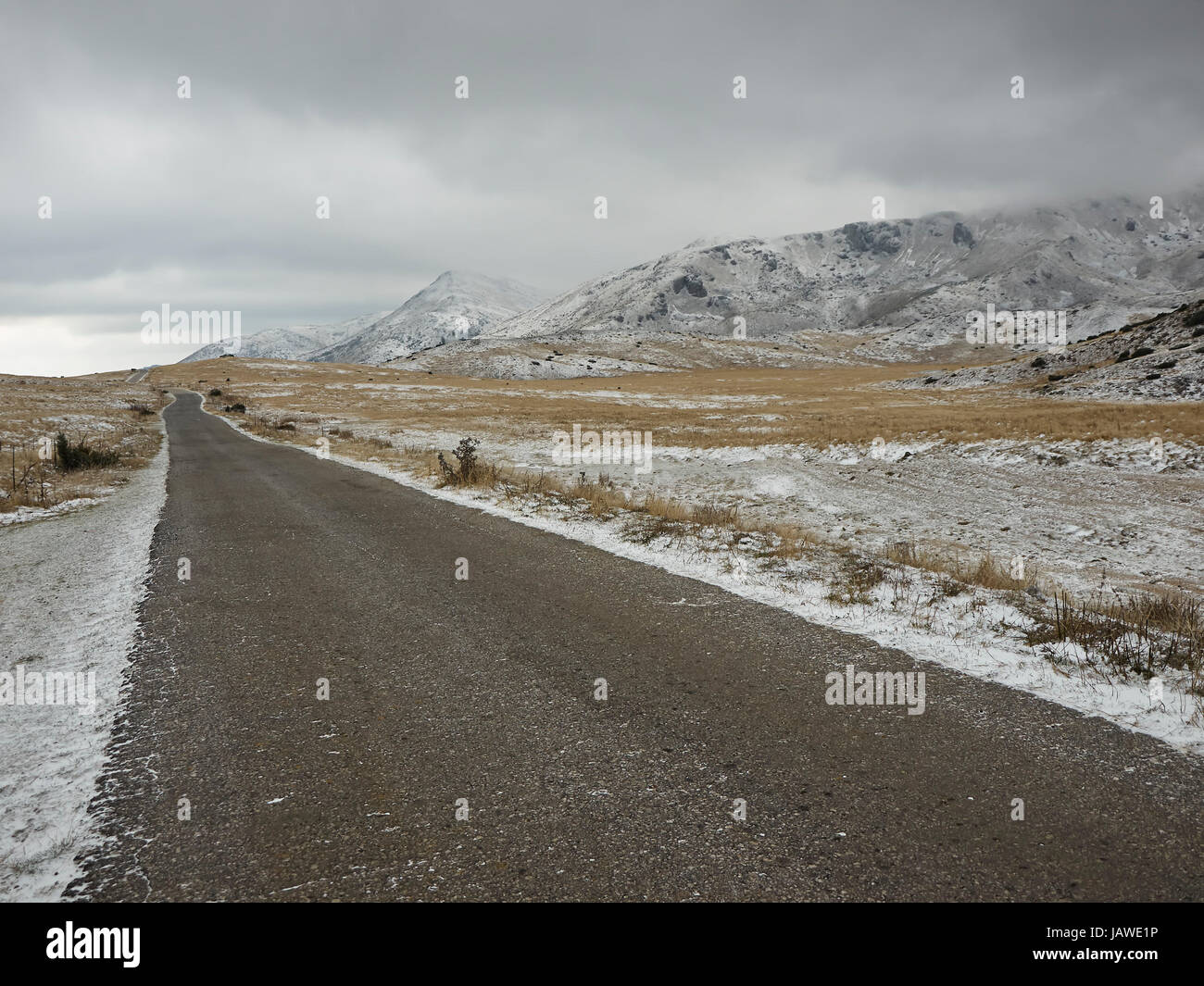 First snow on the road to Galicnik Stock Photo - Alamy