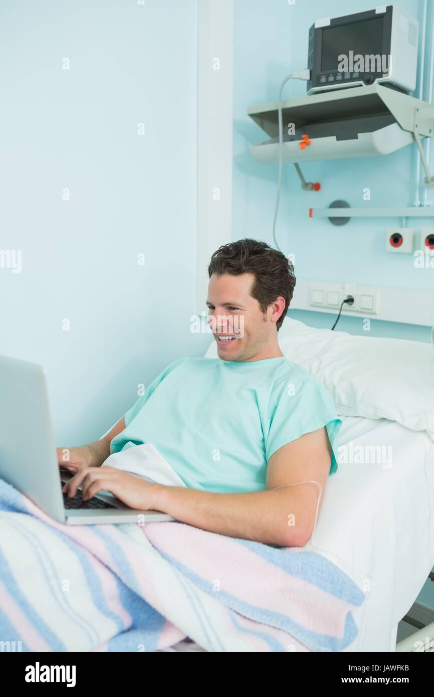 Hospital bed laptop typing hi-res stock photography and images - Alamy