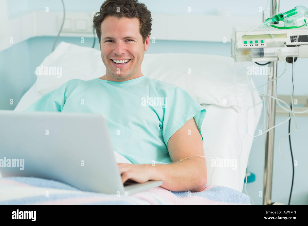 Hospital bed laptop typing hi-res stock photography and images - Alamy