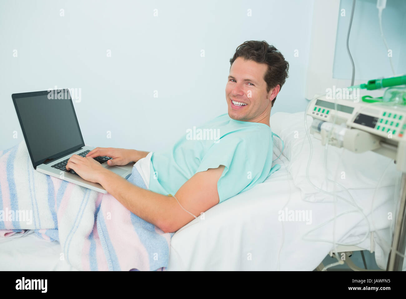 Hospital bed laptop typing hi-res stock photography and images - Alamy