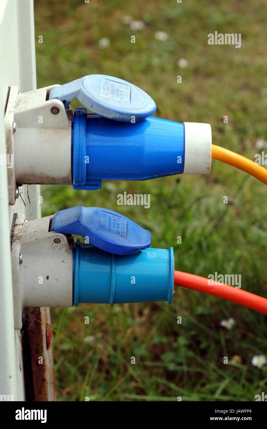 Two three pin outside power plugs connected to a campsite water and ...