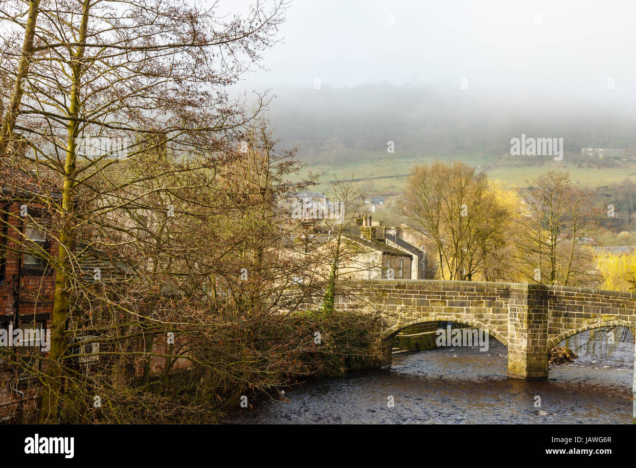 Hebden Beck runs under the 16th Century Packhorse Bridge in the centre ...