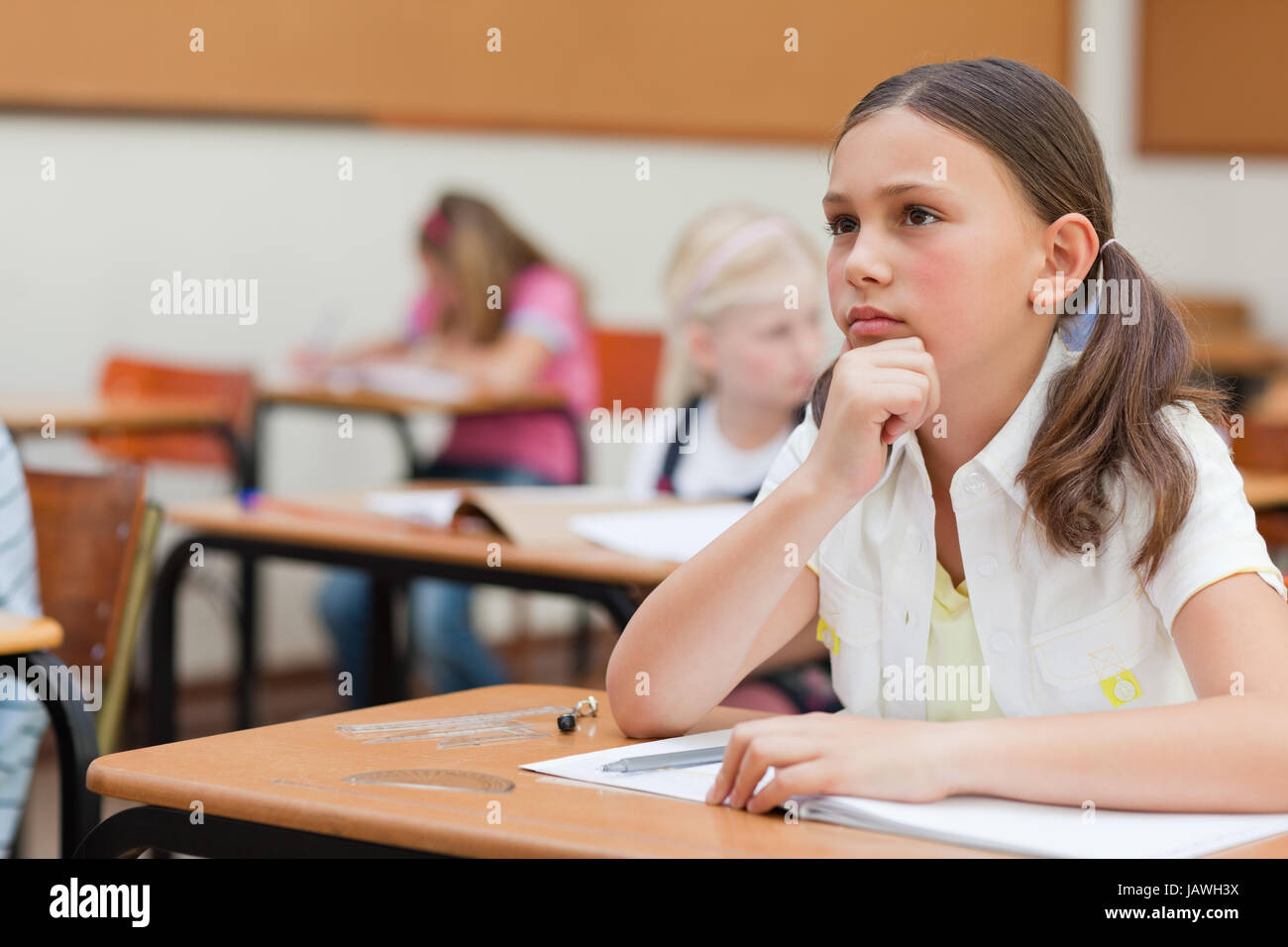 Pretty primary school girl sitting hi-res stock photography and images ...