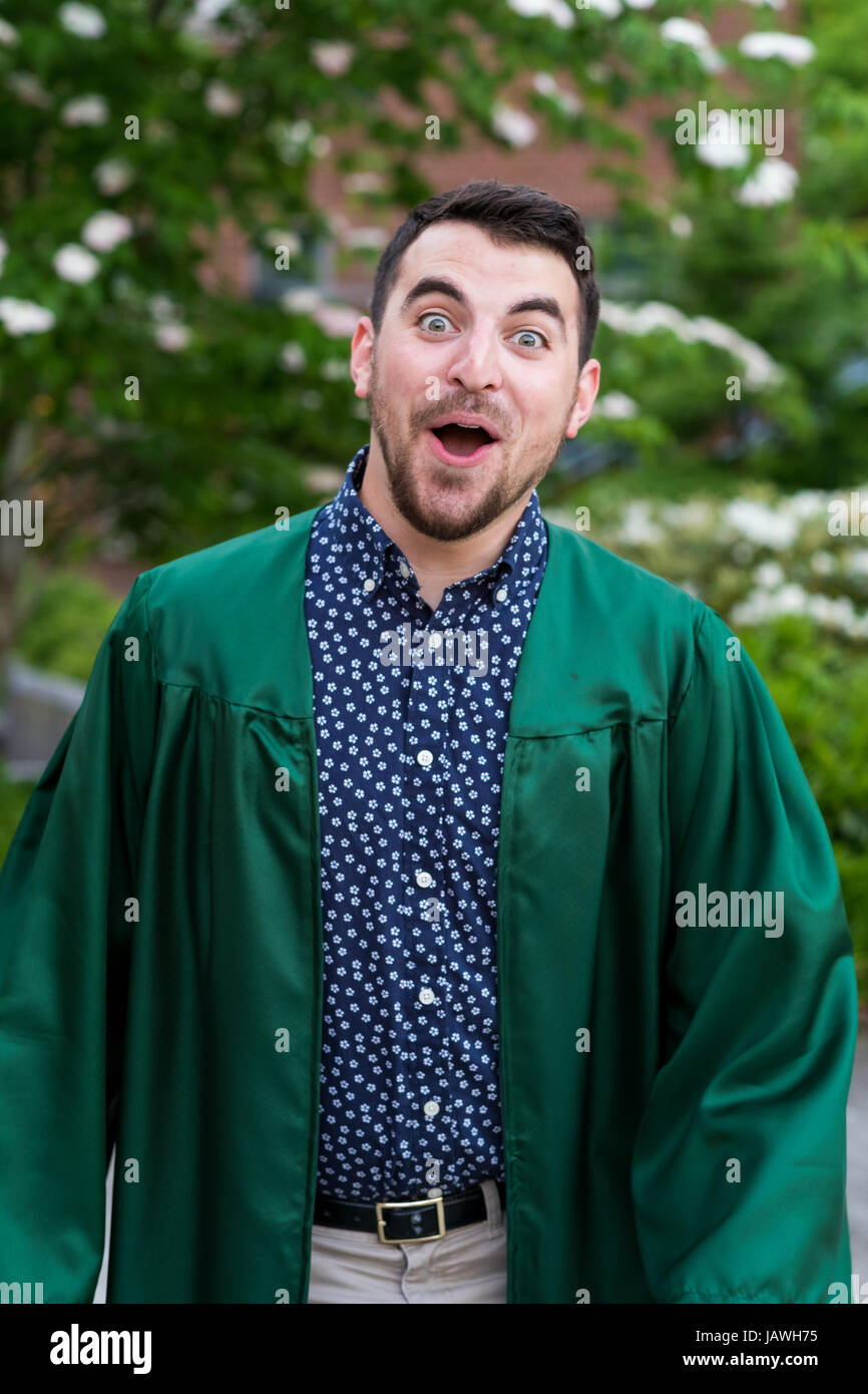 Male model wearing a graduation gown on campus at a university in ...