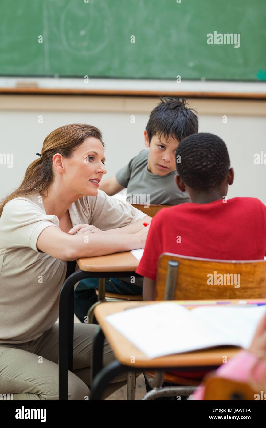 Boy female teacher school talking hi-res stock photography and images ...