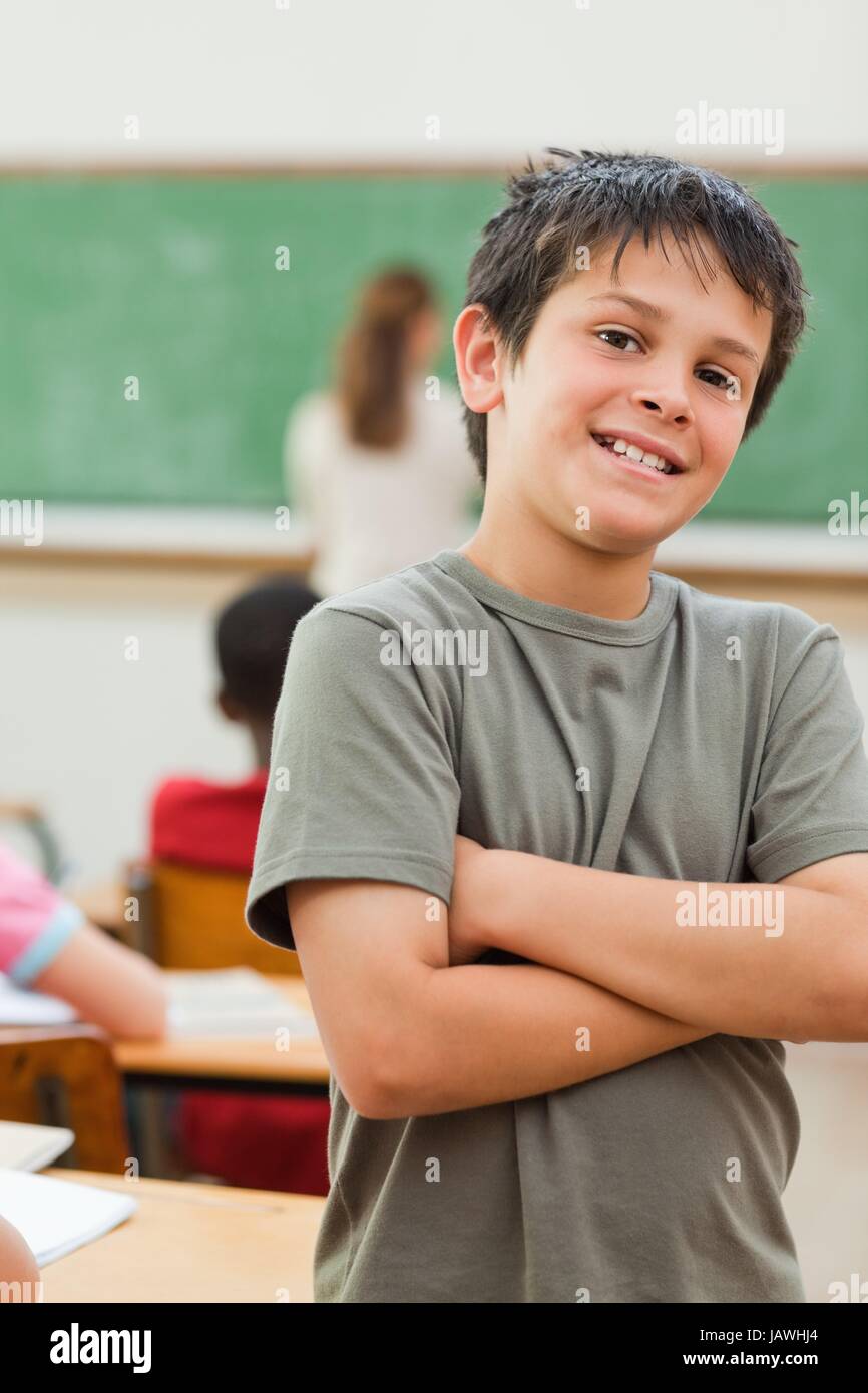 Smiling student with folded arms Stock Photo - Alamy